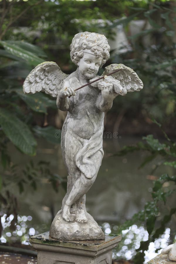 Cupid Statue Sculpture in the Garden. Stock Photo - Image of vintage ...