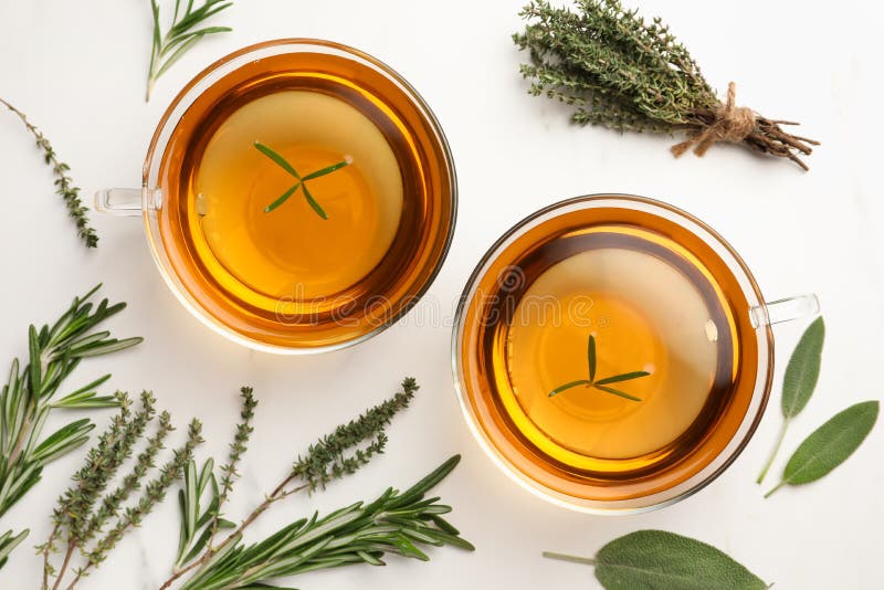 Cups of Aromatic Herbal Tea with Thyme, Rosemary and Sage on White ...