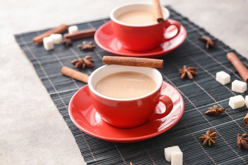 Cups of Aromatic Tea with Milk and Spices on Table Stock Image - Image ...