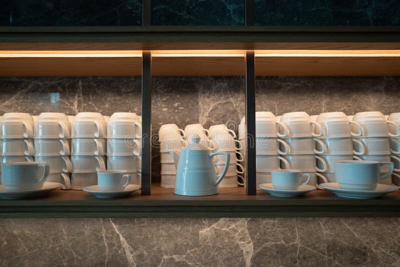 Cups Arranged Properly and Orderly Inside a Cupboard Stock Photo ...