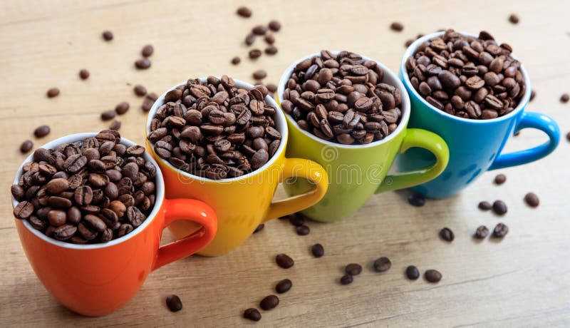 Cups full of coffee beans stock photo. Image of food - 76391596