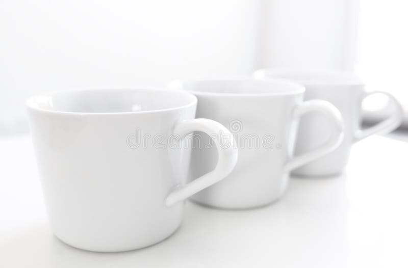 Cups on kitchen table stock photo. Image of balance, quality - 69404456