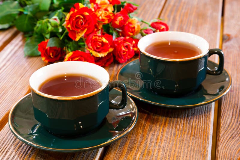 Cups of Tea and Roses Bouquet Stock Photo - Image of orange, love: 25970428