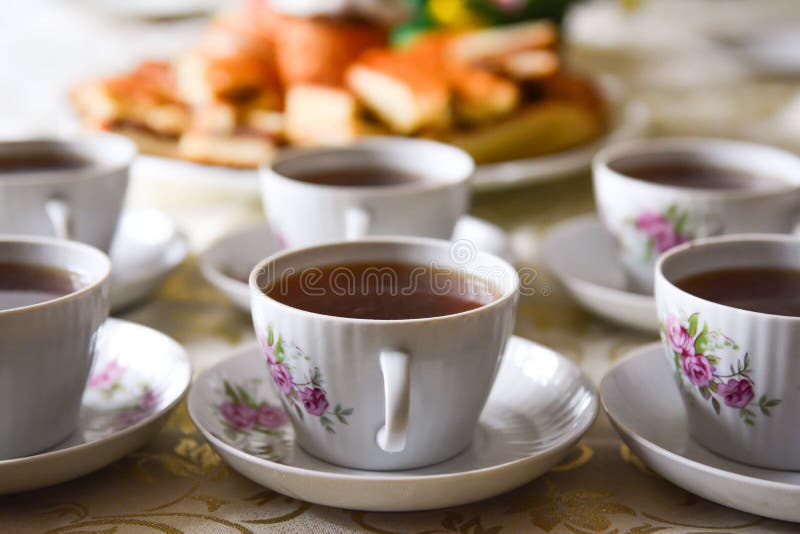 Cups with tea on a table stock image. Image of croissant - 52667525