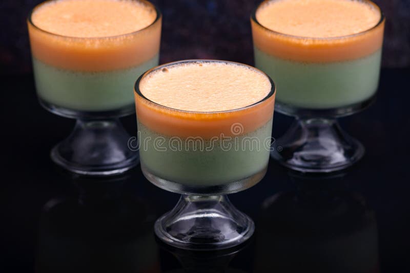 Cups with Two Colors Foamy Gelatin Isolated on Dark Background Stock ...