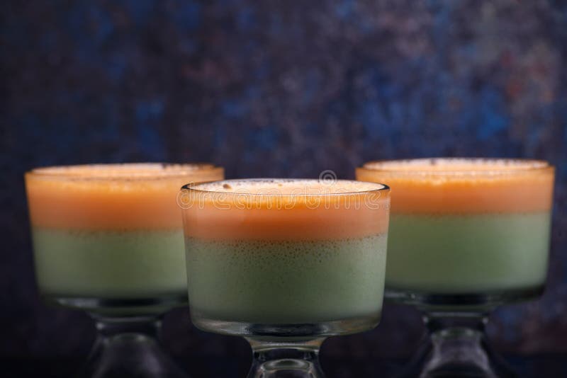 Cups with Two Colors Foamy Gelatin Isolated on Dark Background Stock ...