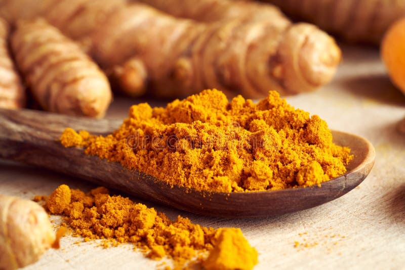 Dry Ground Curcuma Turmeric Indian Seasoning for Medicine on Wood Stock ...