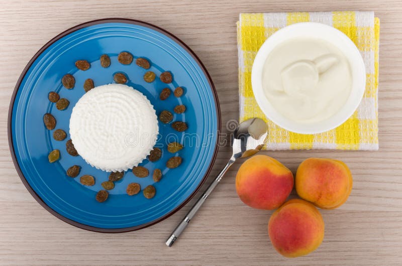 Curd and Raisins in Blue Plate, Sour Cream and Peaches Stock Image ...
