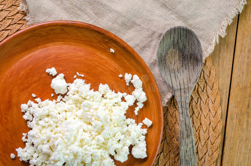 Curds on the brown plate stock image. Image of plate - 62669075