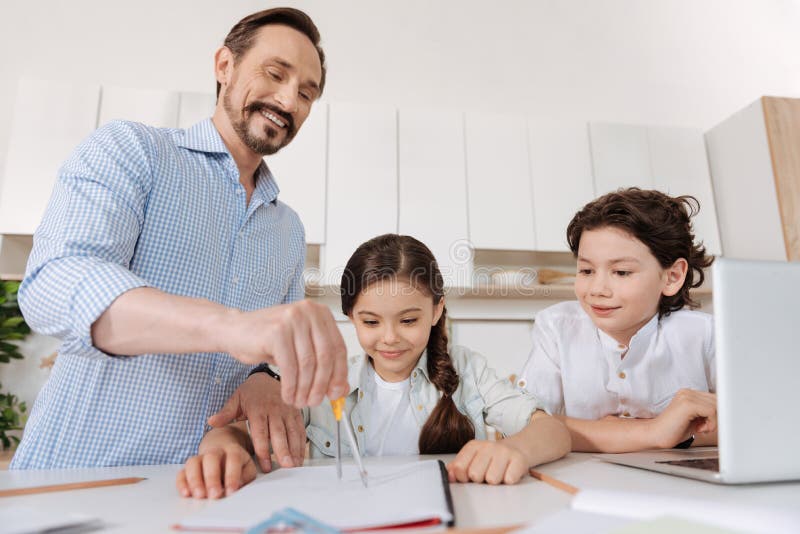 Curious Children Watching Their Father Using Compass Stock Image ...