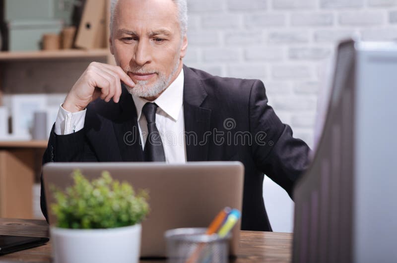 Curious Gentleman Watching Something on His Computer Stock Image ...