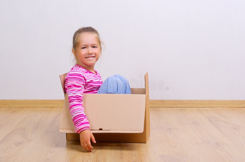 Curious Girl in Cardboard Box Stock Image - Image of floor, cardboard ...