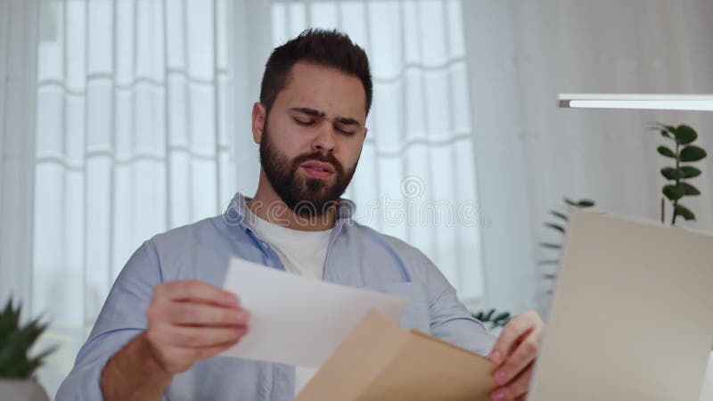 Curious Guy Receiving Paper Envelope and Expressing Frustration with ...