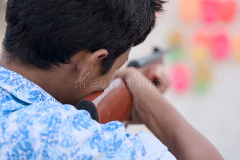 Curious Kid with Toy Gun stock image. Image of beach - 323053801