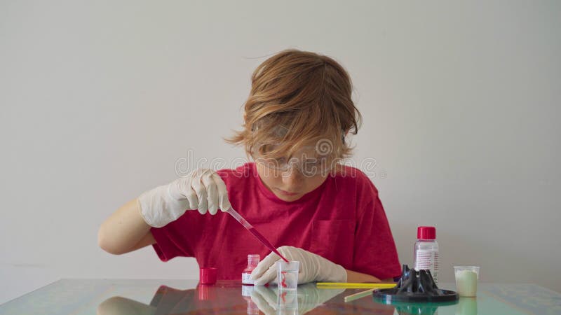 A Curious Little Boy Conducts Science Experiments at Home, Exploring ...