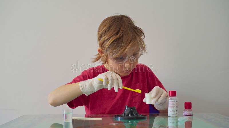 A Curious Little Boy Conducts Science Experiments at Home, Exploring ...