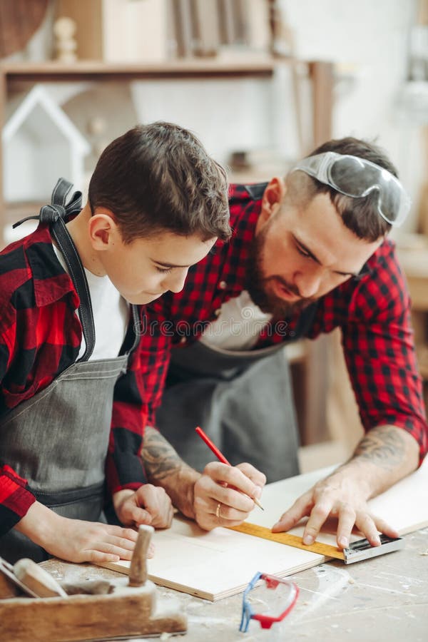 Men with Ruler and Pencil Measuring Wooden Plank for Work Stock Image ...