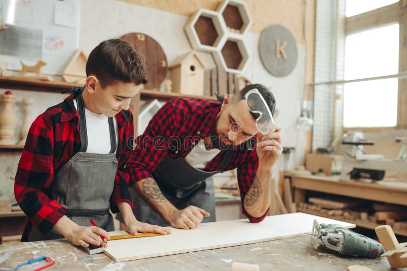 Men with Ruler and Pencil Measuring Wooden Plank for Work Stock Image ...