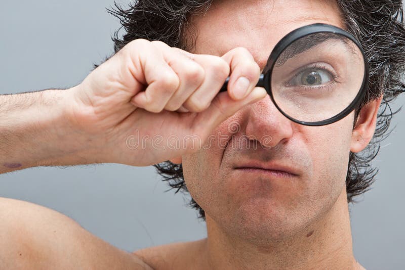 Curious man with magnifier stock photo. Image of attractive - 14839450