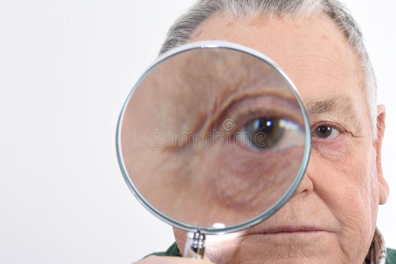 Curious Man Peering through Magnifying Glass Stock Image - Image of ...