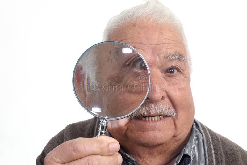 Curious Man Peering through Magnifying Glass Stock Photo - Image of ...