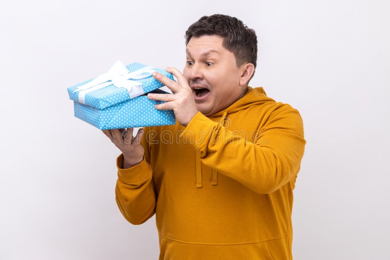 Curious Middle Aged Man with Present in Hands Looking Inside Gift Box ...