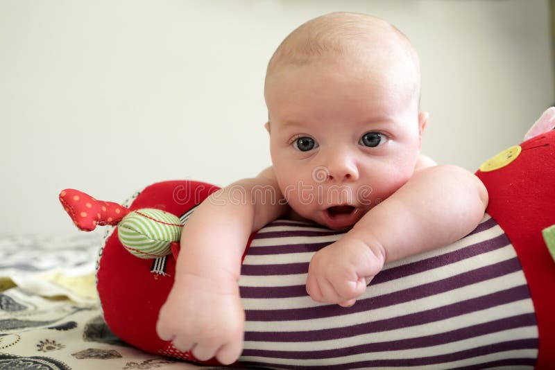 Curious Newborn Baby Boy Lying on a Crawling Roll Stock Image - Image ...