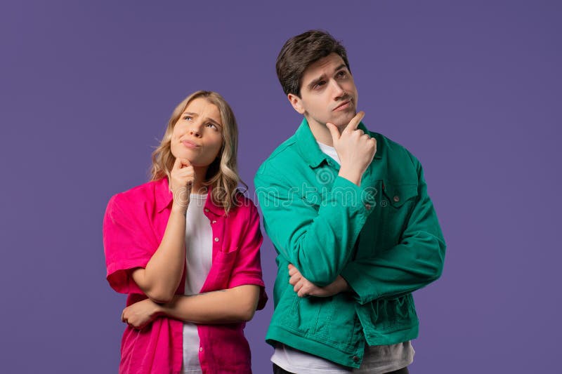 Curious Young Couple Analyzing on Violet Studio. Mindful Man Woman ...