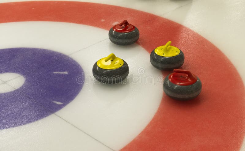 Four curling stones stock photo. Image of throw, action - 18696422