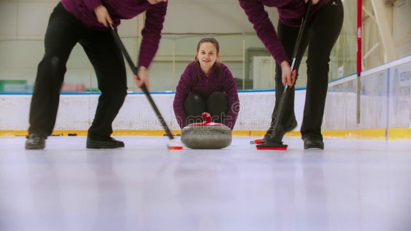 Curling Training on the Ice Rink - Leading Granite Stone on the Ice and ...