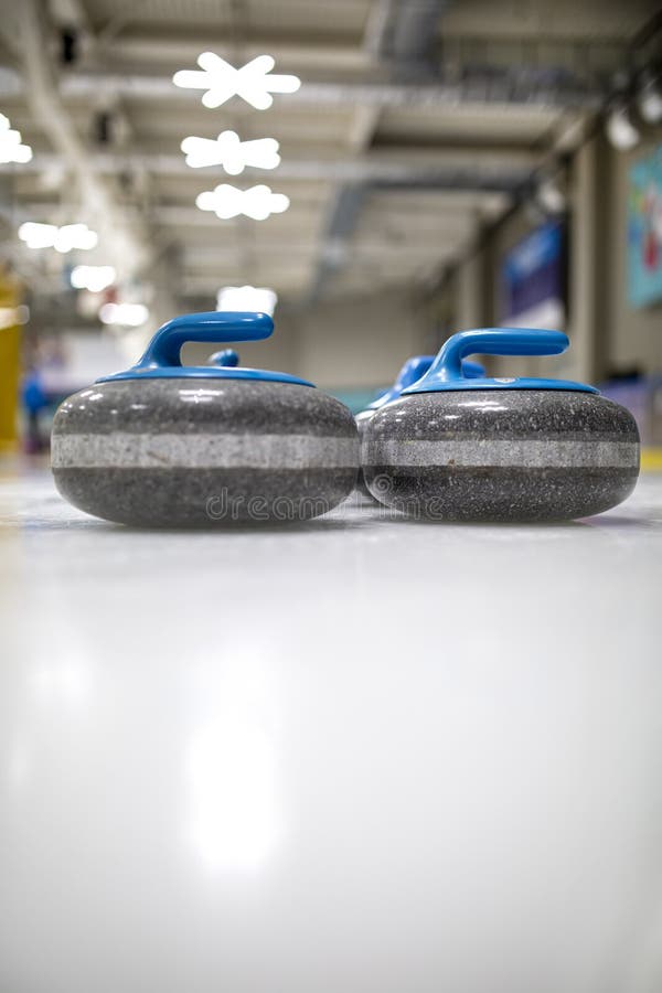 The Curling Stone or Rock is Made of Granite with Blue Handles Lie ...