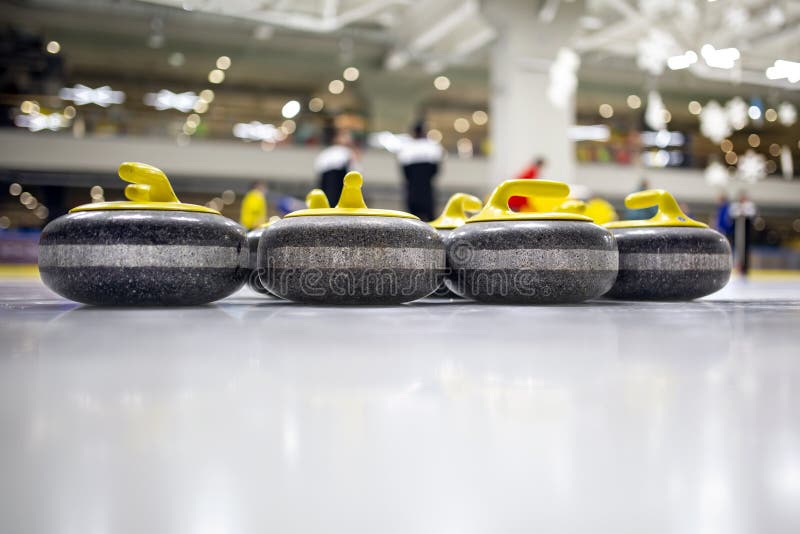 The Curling Stone or Rock is Made of Granite with Yellow Handles Lie ...
