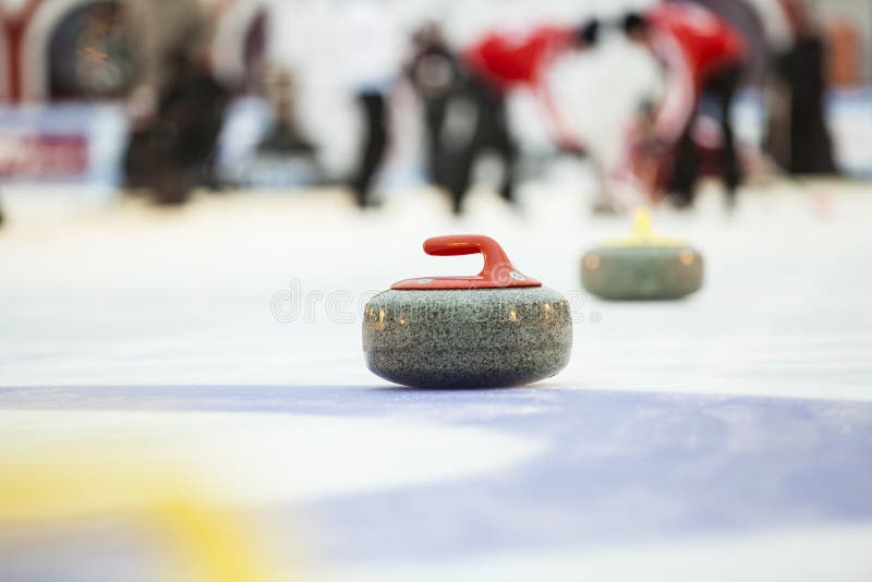 Curling stock image. Image of feet, blue, yellow, players - 12954133