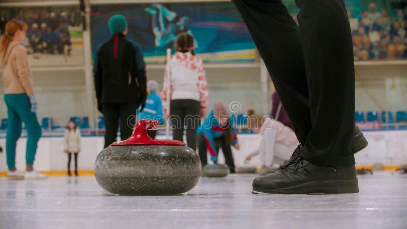 Curling Training - a Granite Stone with Red Handle and a Person ...