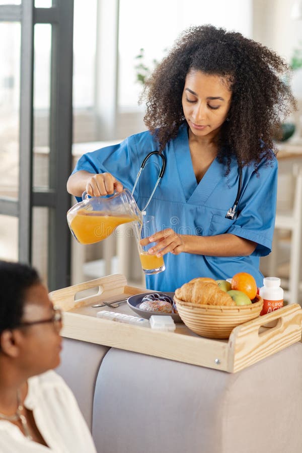 Curly Dark-skinned Nurse Preparing Breakfast for the Patient Stock ...