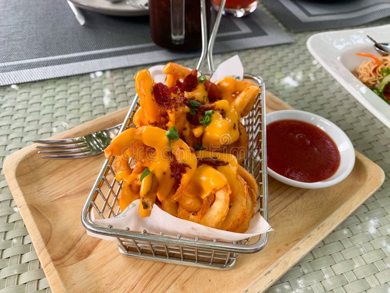 Curly Fries with Cheese and Bacon with Ketchup Stock Photo - Image of ...