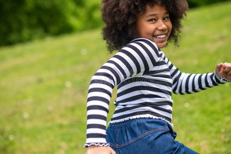 Curly-haired Cute Kid Running and Feeling Excited Stock Image - Image ...