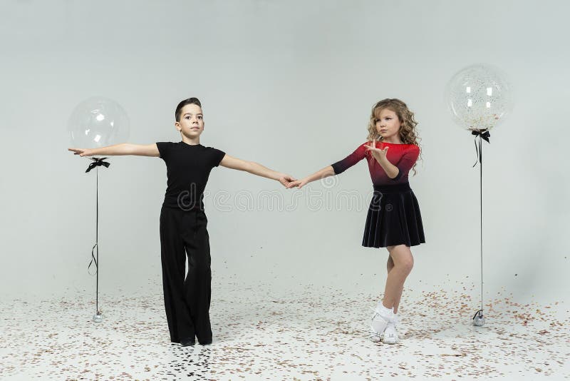 Curly-haired Girl and a Boy Engaged in Ballroom Dancing Pose Showing ...