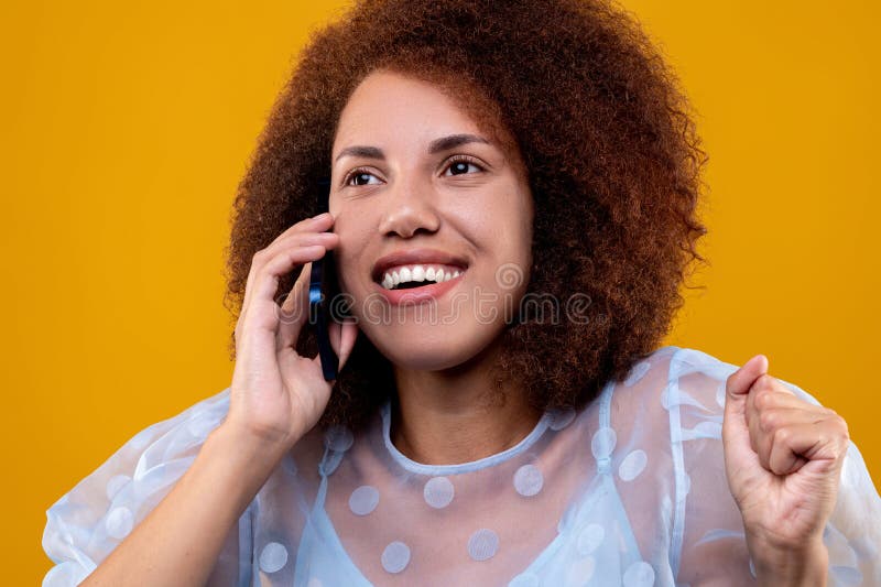 Curly-haired Young Woman Talking on the Phone Stock Photo - Image of ...