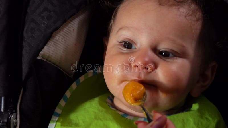 Curly Hungry Baby Boy Cries and Eats Mashed Vegetables Stock Video ...