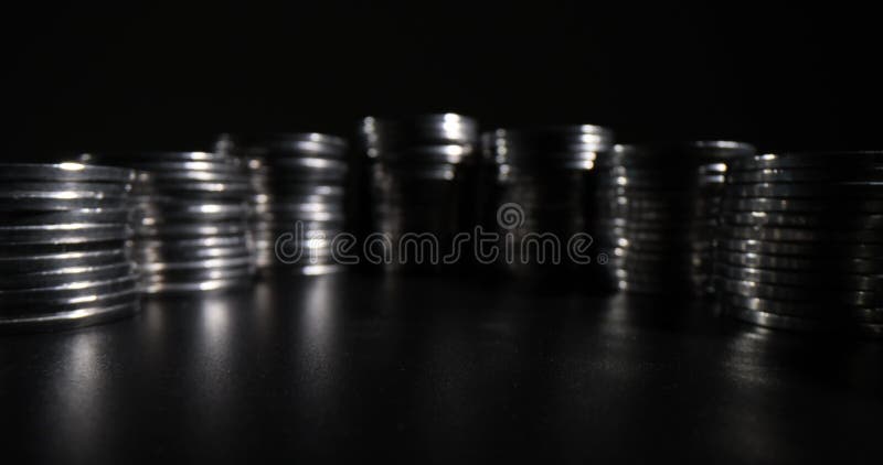 Curly Line of Stacks Made of Silver Coins on Black Surface Stock Video ...