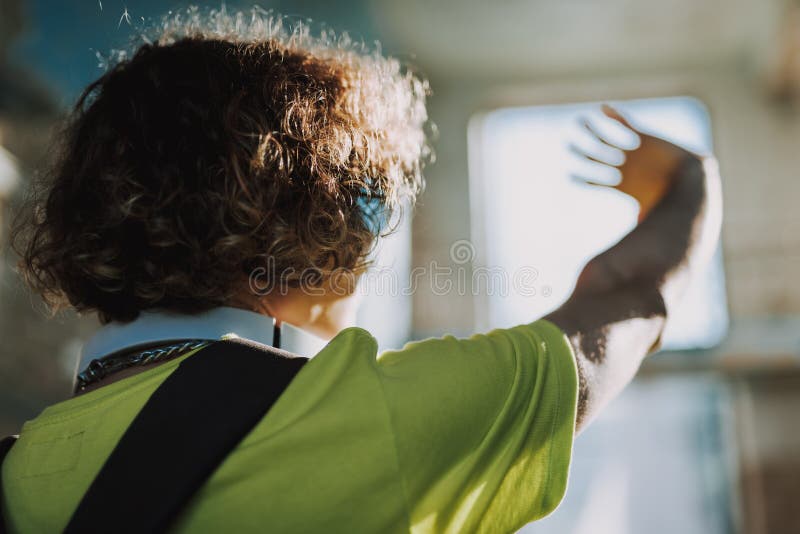 Curly Man in Sunlight with Hand Putting Forward Stock Image - Image of ...