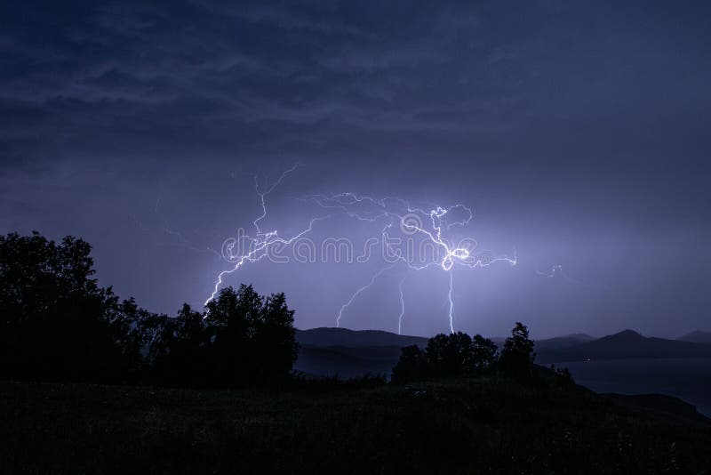 Curly Shaped Lightning Strike Over Mountain Range in Ural Stock Photo ...