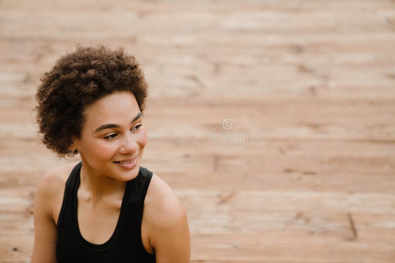 Curly Woman Smiling during Yoga Practice Outdoors Stock Photo - Image ...