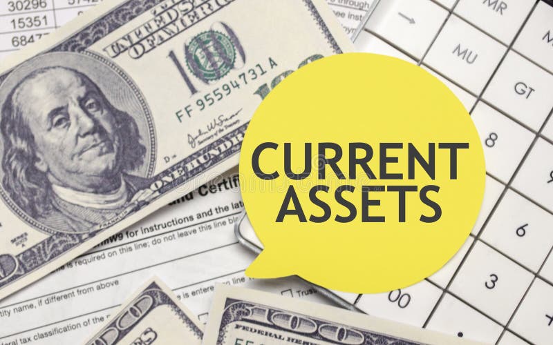 CURRENT ASSETS Words on Yellow Sticker with Dollars and Charts Stock ...