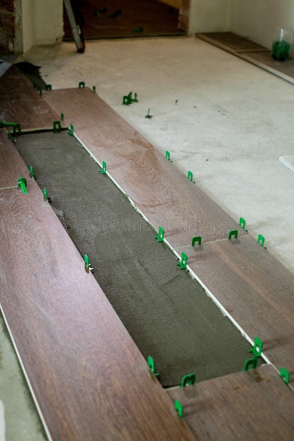 Currently Laying Wooden Tiles on a Floor Surface Stock Image - Image of ...