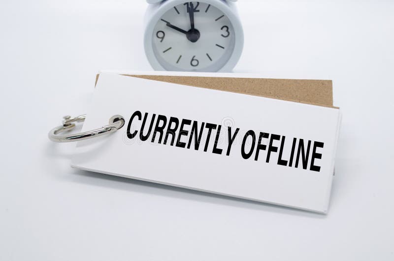 Currently Offline Text on White Notepad with Alarm Clock on White ...