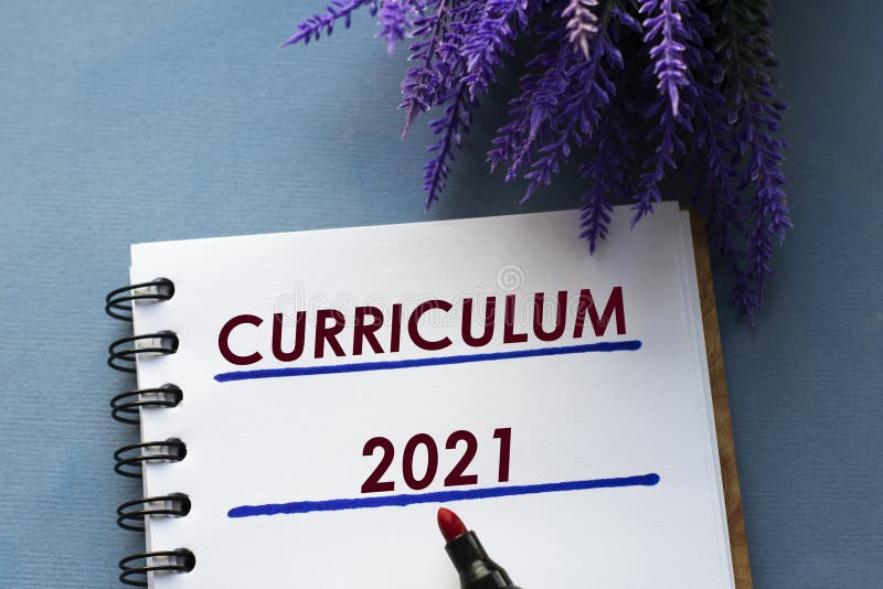 CURRICULUM 2021- Written in a Notebook on a Gray Background with ...