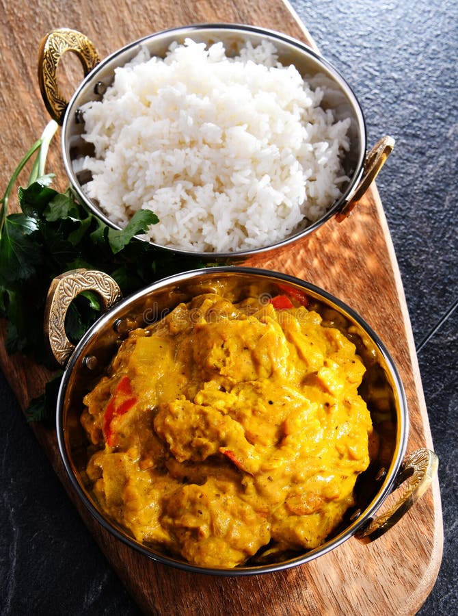 Curry Chicken with Rice Served in Original Indian Karahi Pots Stock ...