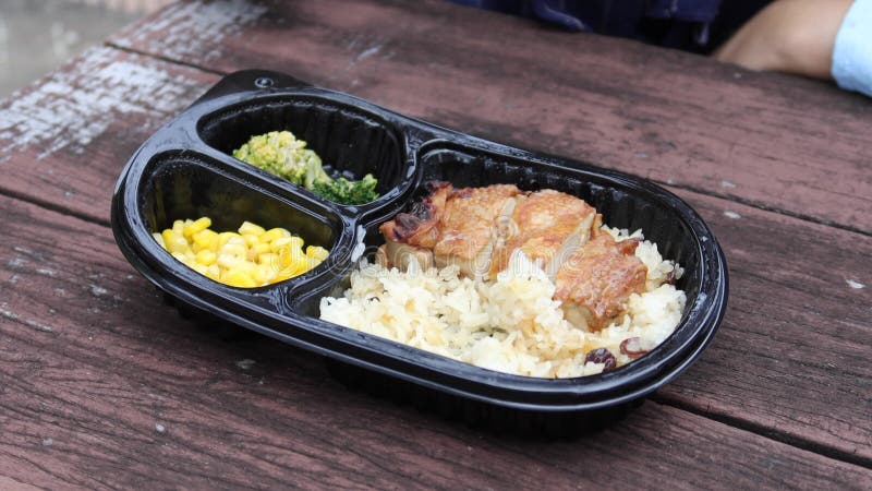 Curry Chicken and Rice in a Take Away Plastic Packet on Table Stock ...